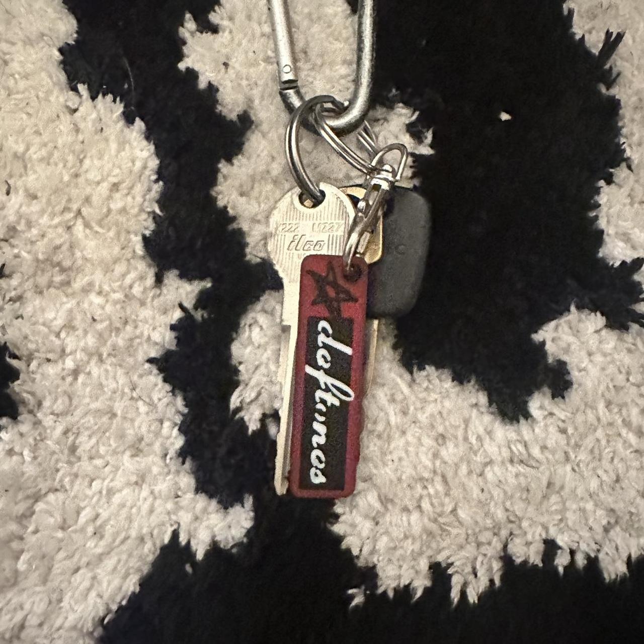red deftones charms key chain high quality... - Depop