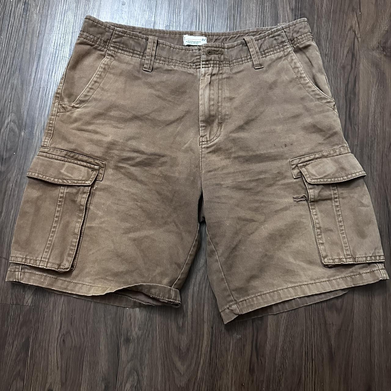 Brown Cargo Shorts only flaw is a missing button in... - Depop