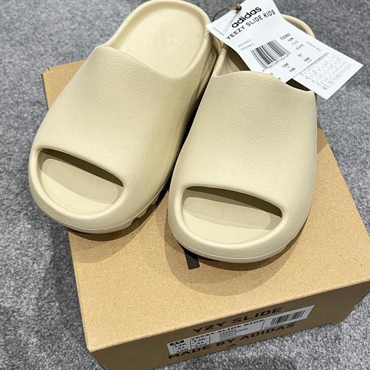 Yeezys slides kids - size 12k. Bought for my 5 year... - Depop