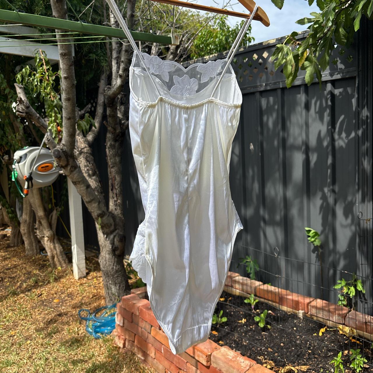 Vintage white bodysuit with floral embellishments... | Depop