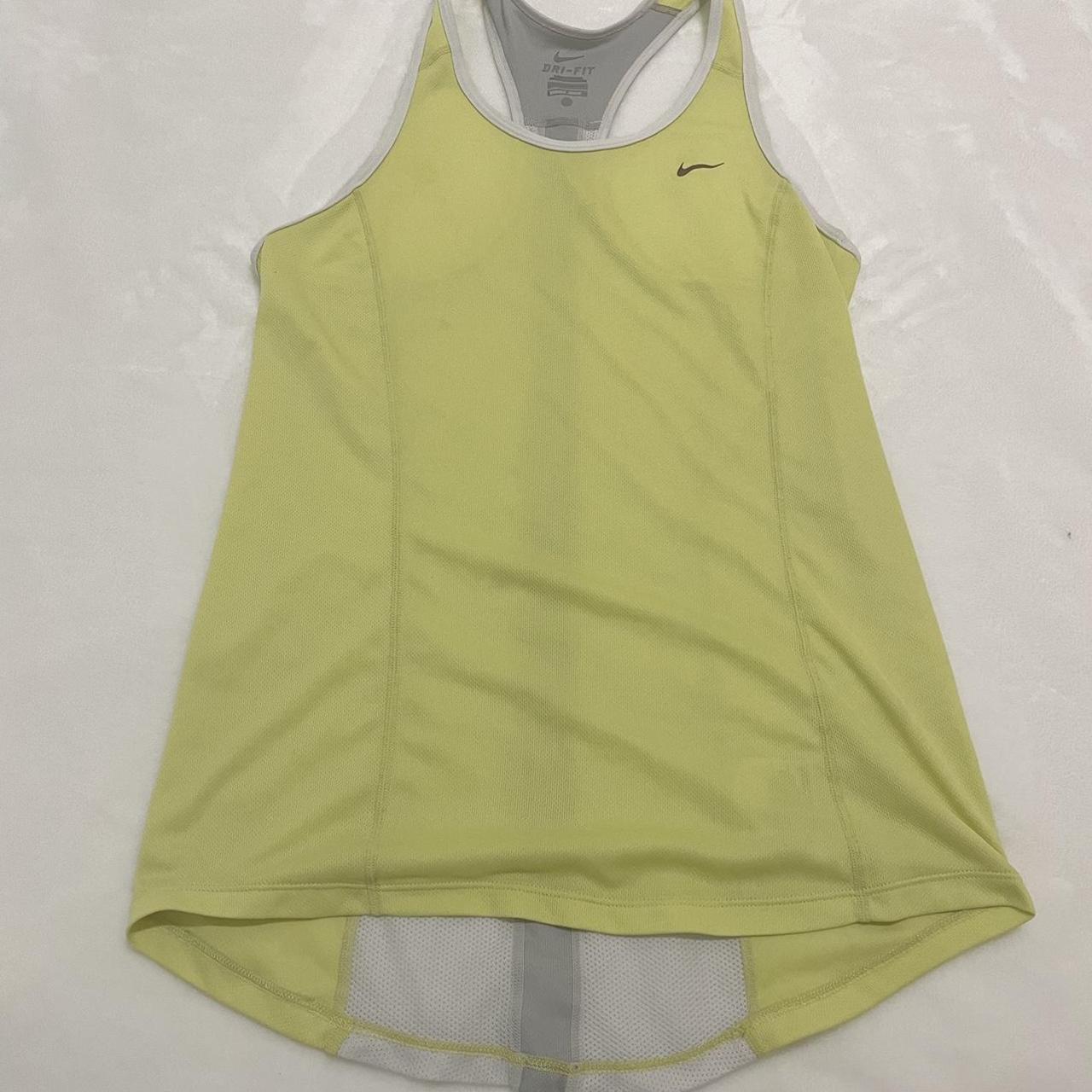 Nike yellow workout top Size: s Small stain but... - Depop