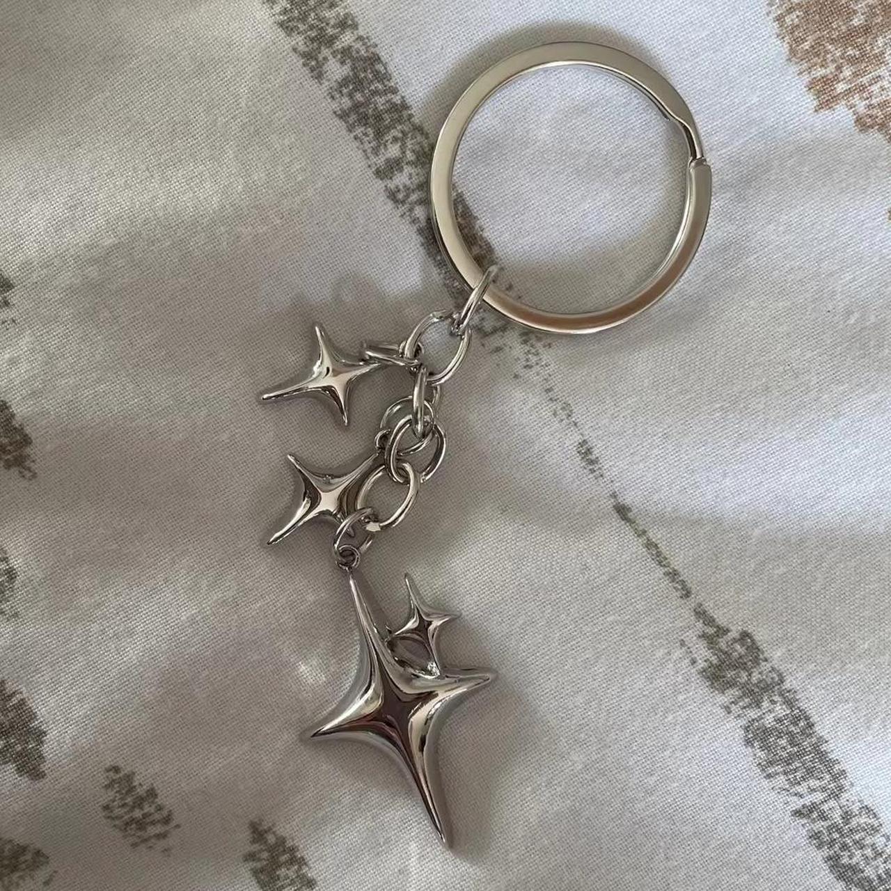 Y2K Silver star keychain with a touch of sparkle... - Depop
