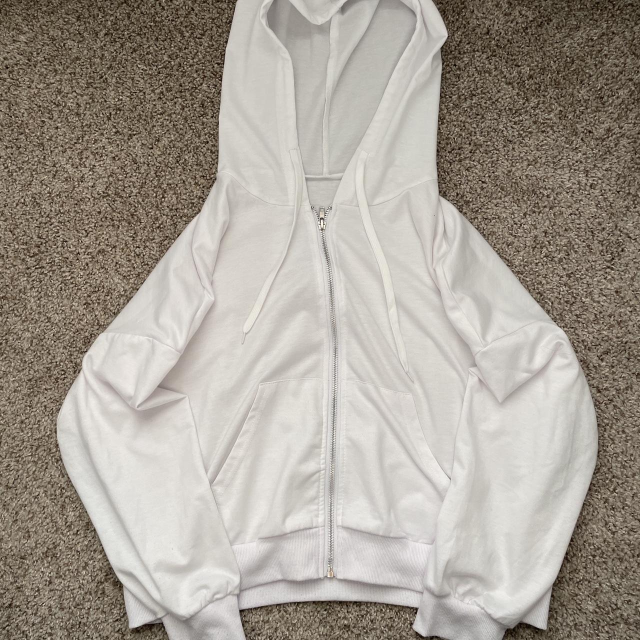 cropped white zip up hoodie. size large but is still... - Depop
