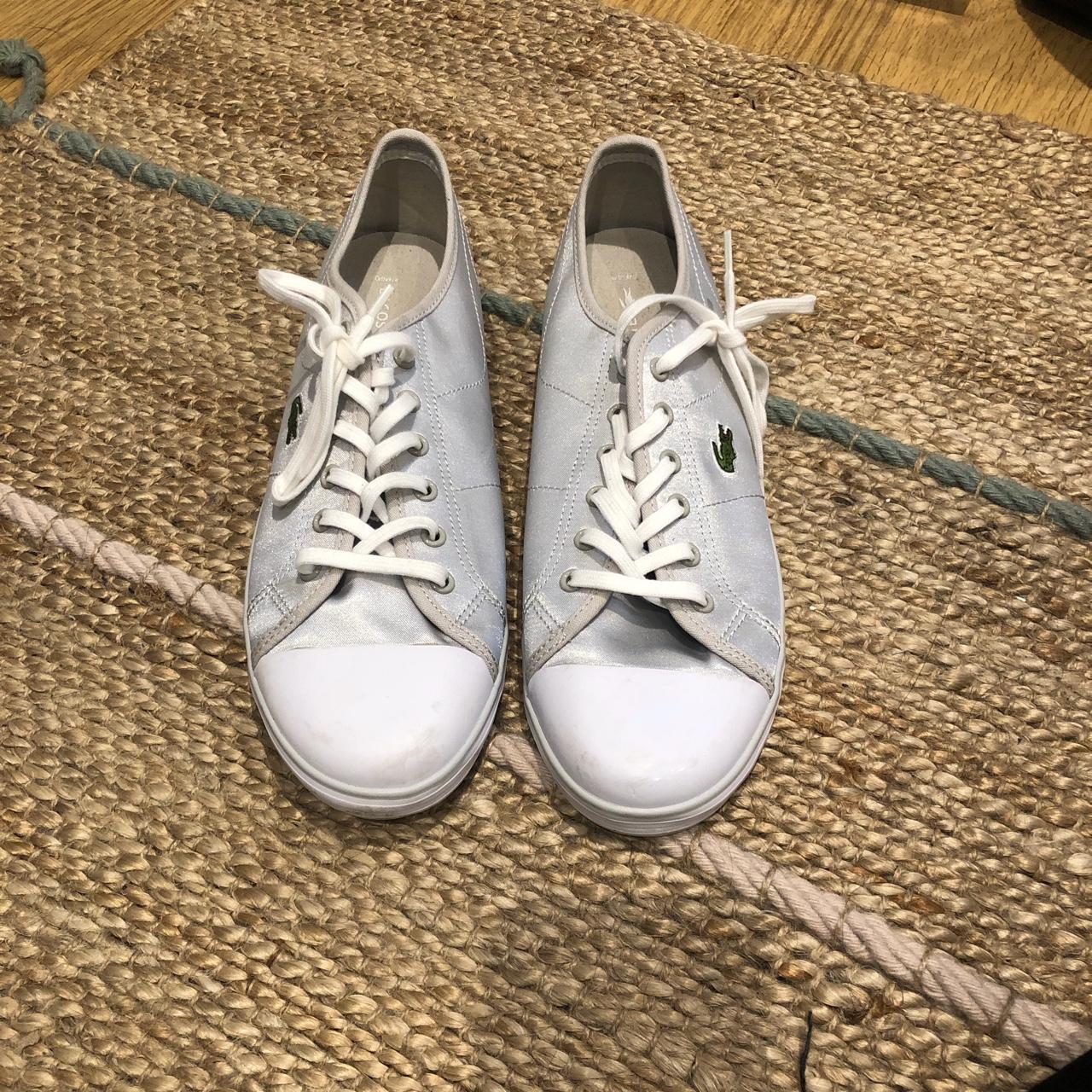 Silver Lacoste trainers worn once. Slight marks... - Depop
