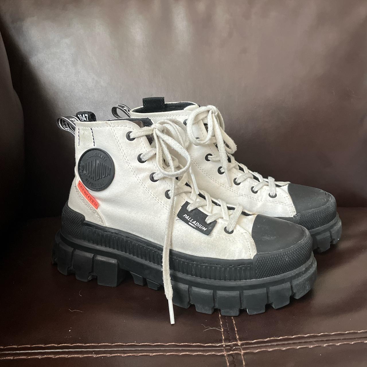 A pair of white platform shoes with the brand... - Depop