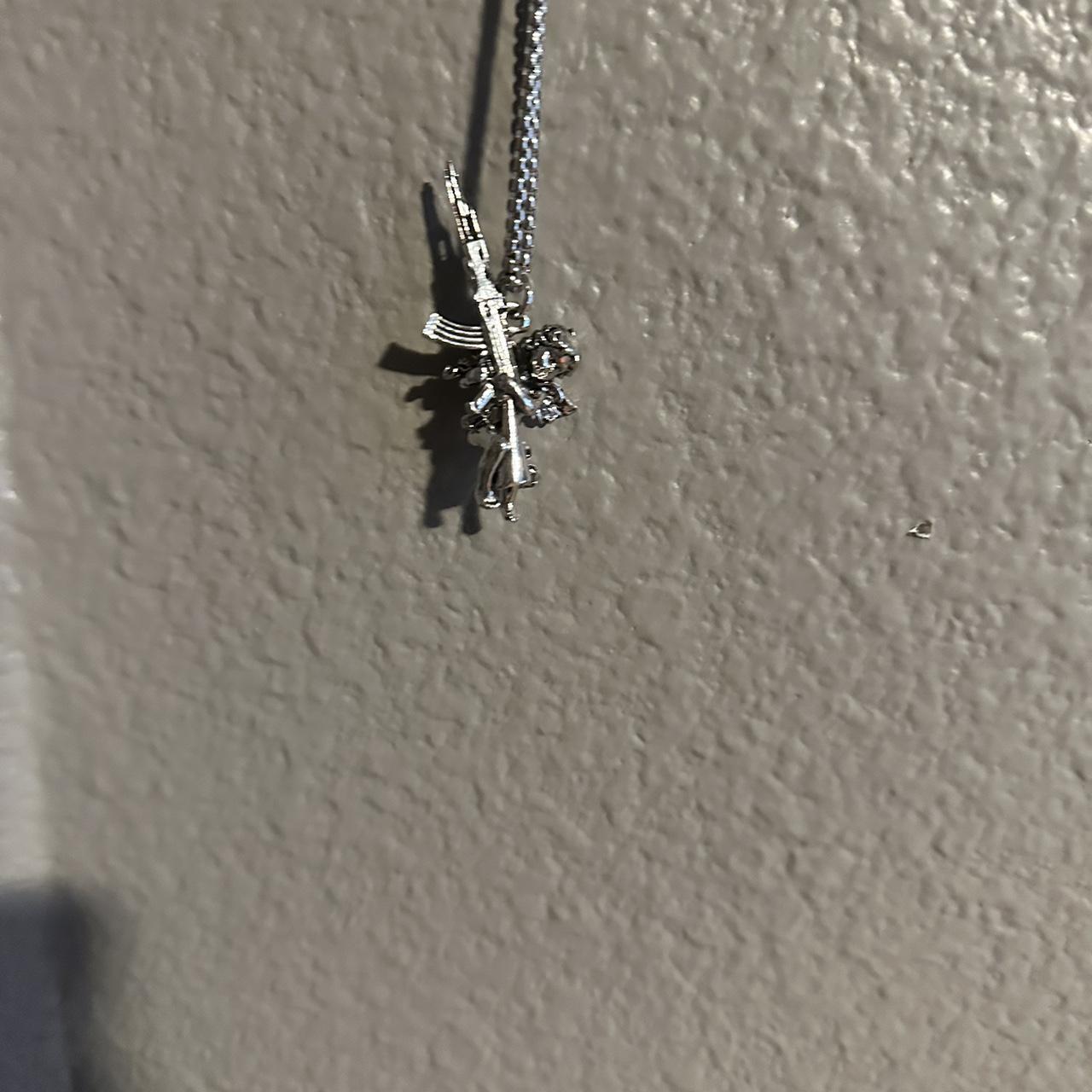 Sick chain, Cupid holding and Ak. Ion ever wear ts... - Depop