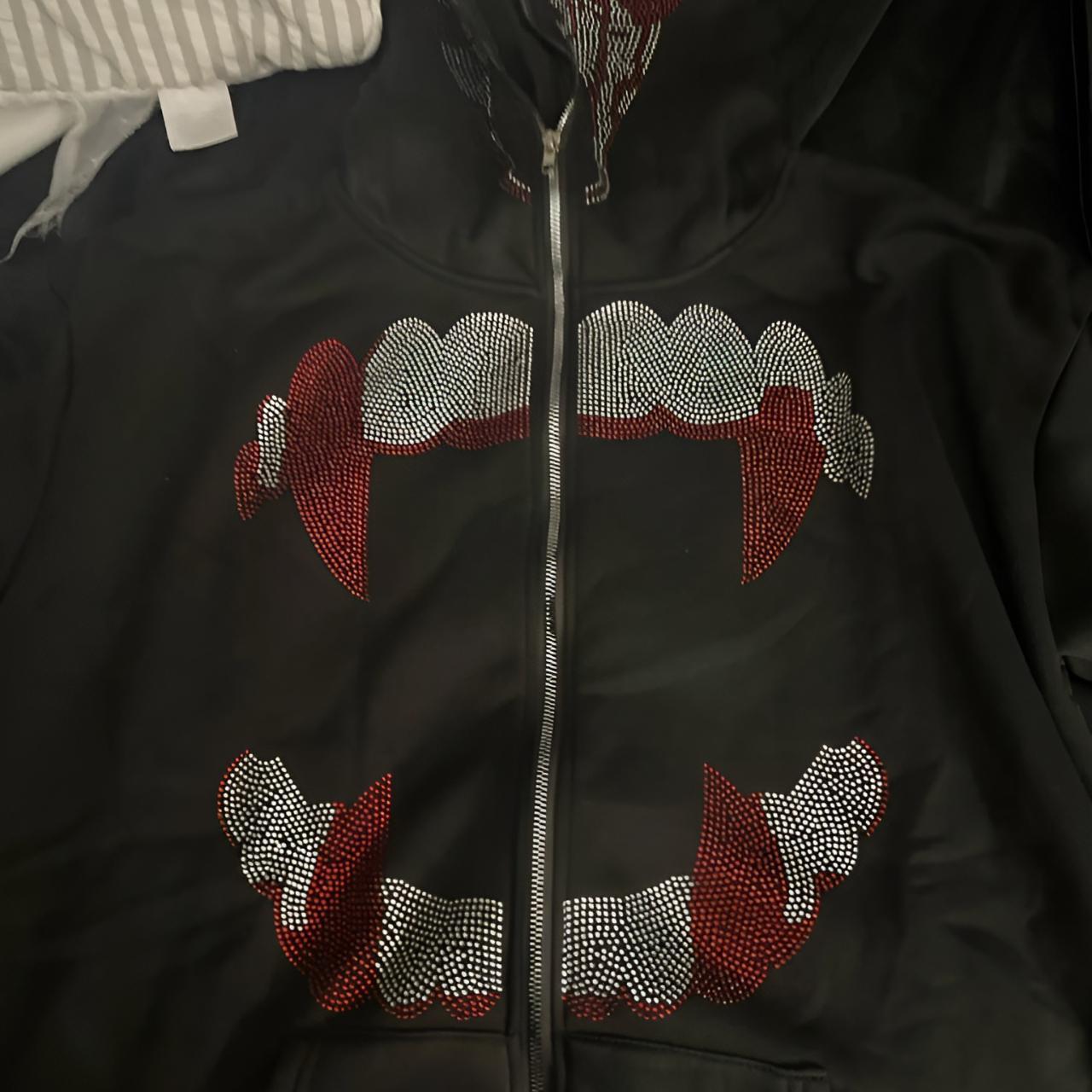Opium Y2K style zip-up hoodie. does have pretty... - Depop