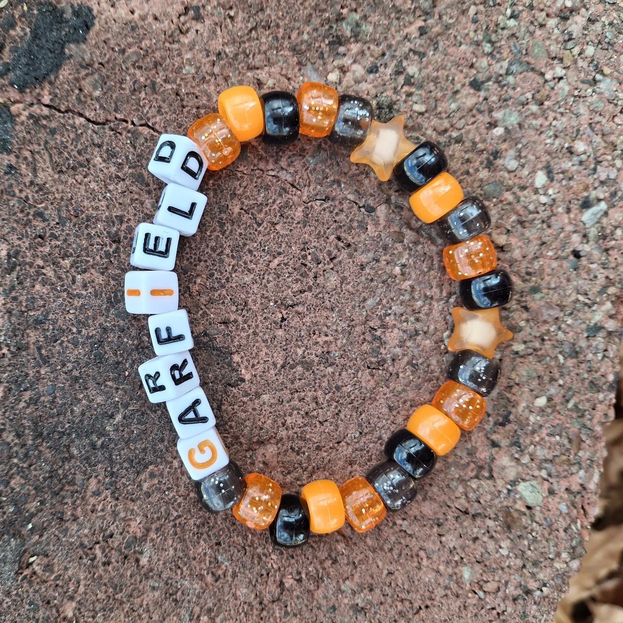 Garfield kandi bracelet 🧡🖤 Handmade with a stretchy... | Depop
