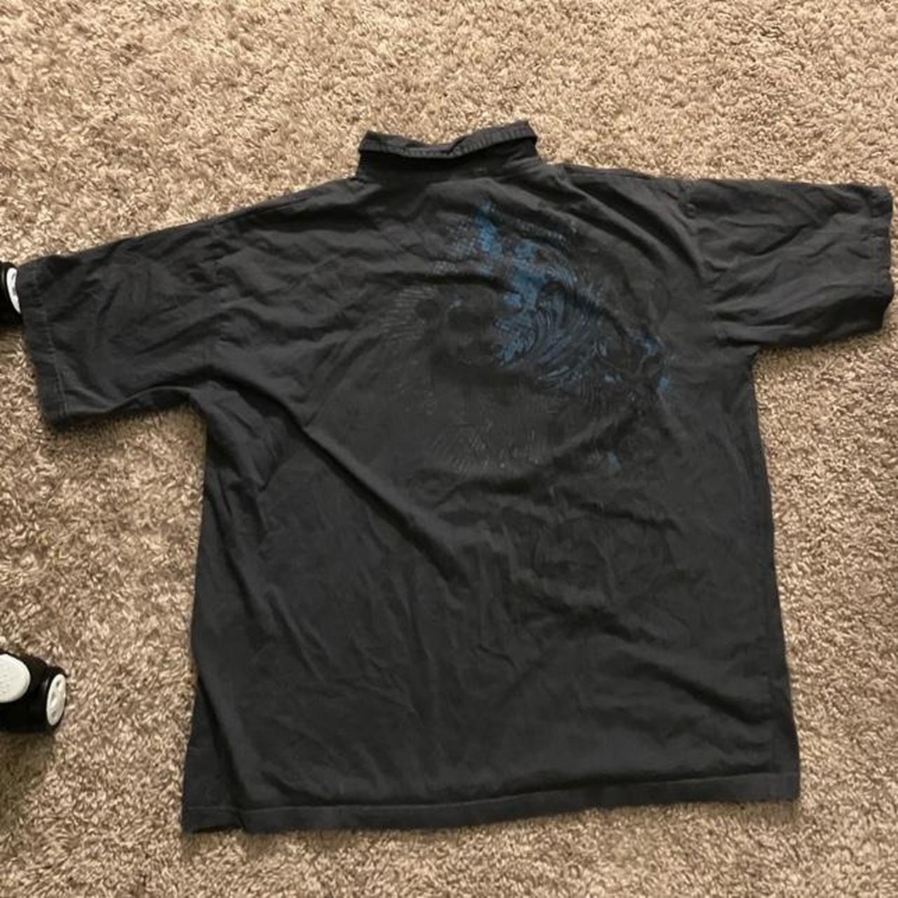 affliction style polo dark grey with blue designs... - Depop