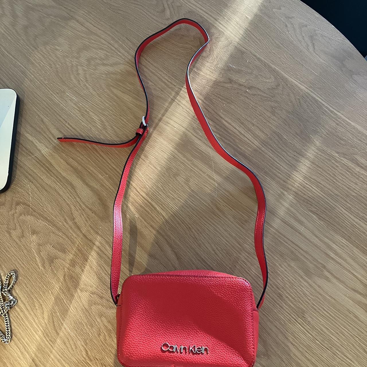 Calvin Klein red handbag Small scuff on the back... - Depop