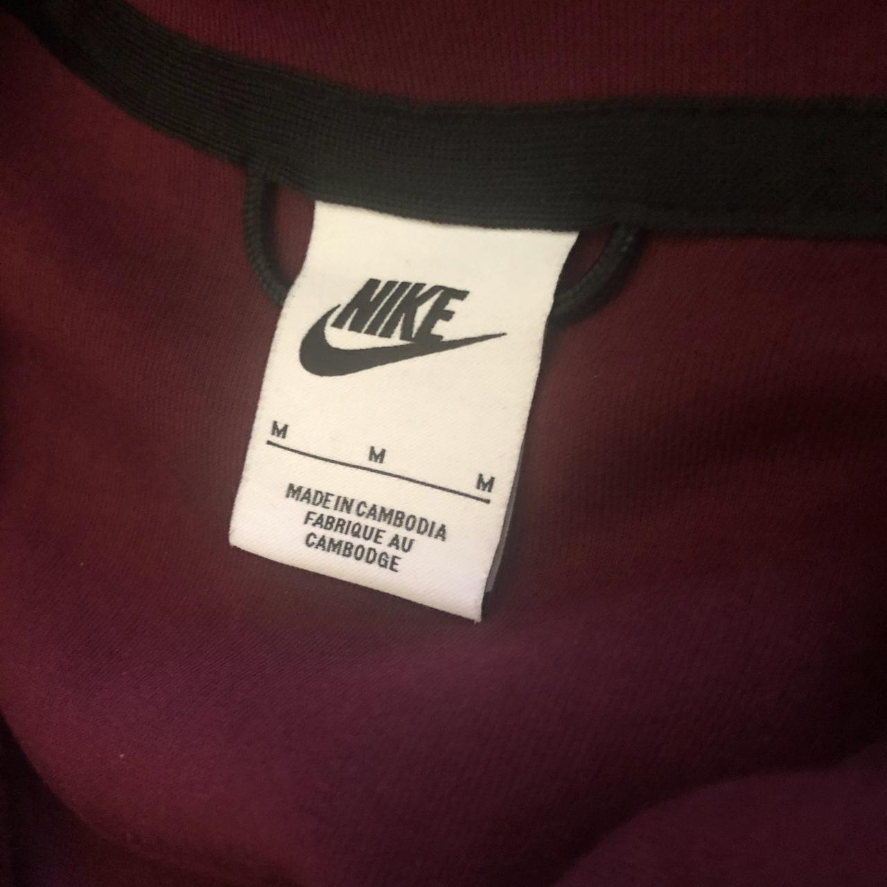 Maroon Nike Tech Fleece -size M -light tear near... - Depop