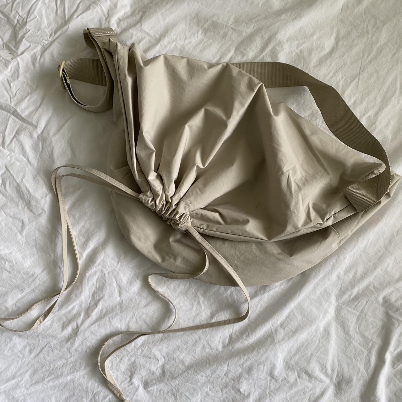Uniqlo U Drawstring Shoulder Bag There is a... - Depop