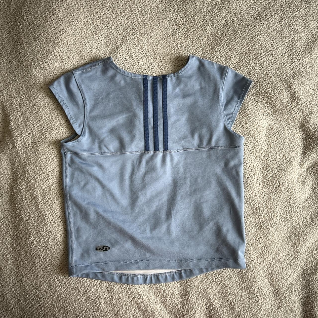 Light blue adidas workout top, fits me pretty snug... - Depop
