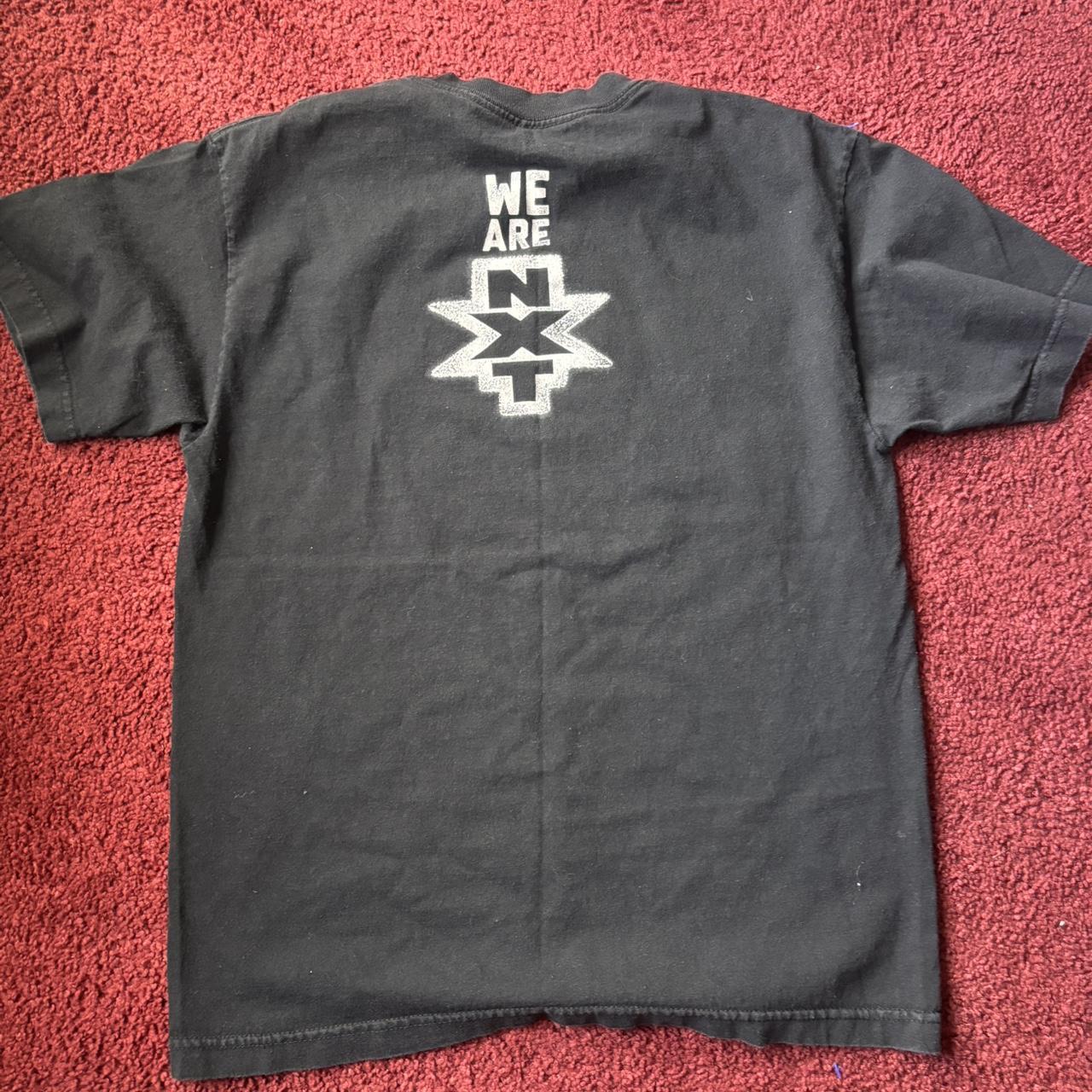 Black and white NXT wrestling t-shirt... | Depop