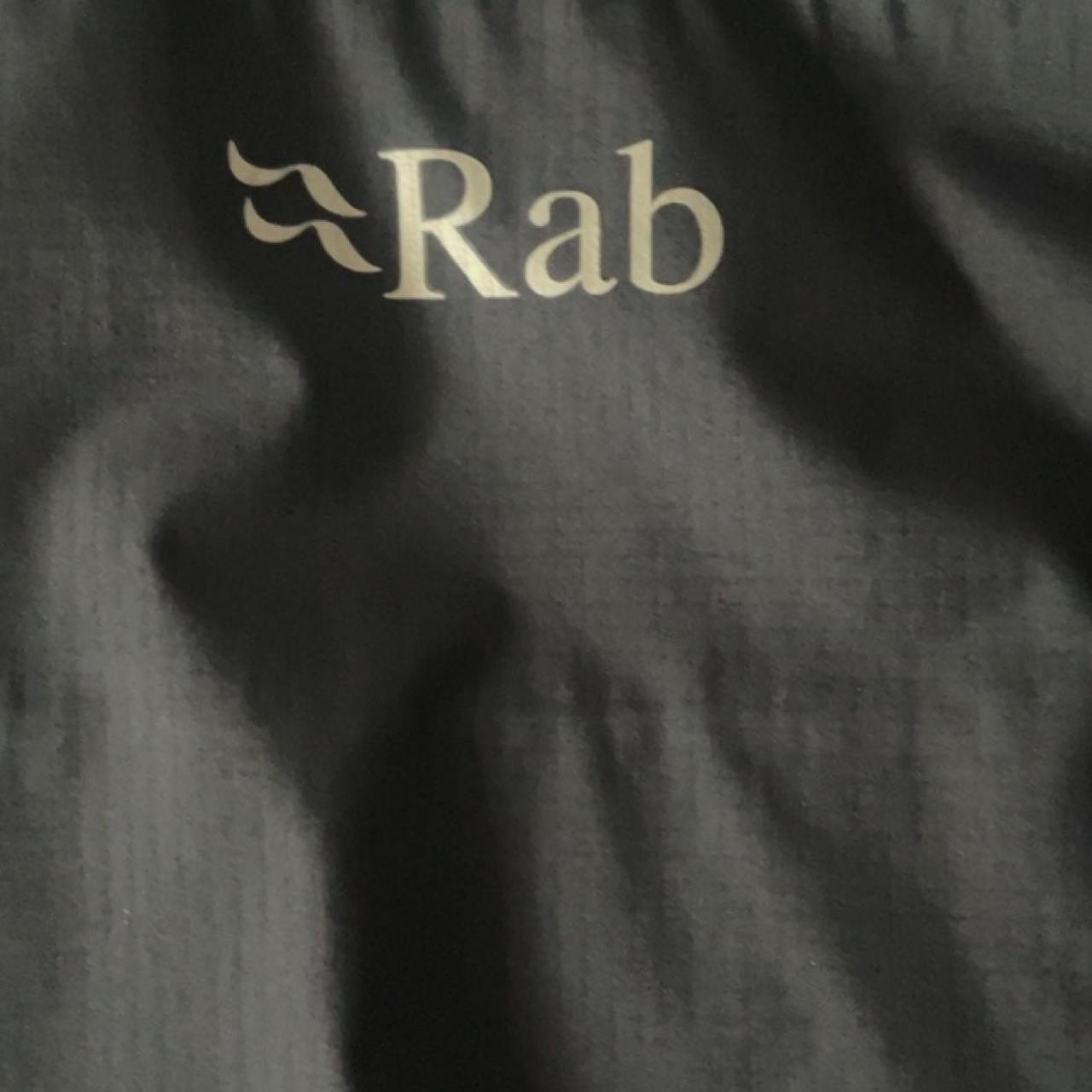 Small rip near the bottom zip of the Large black RAB... - Depop