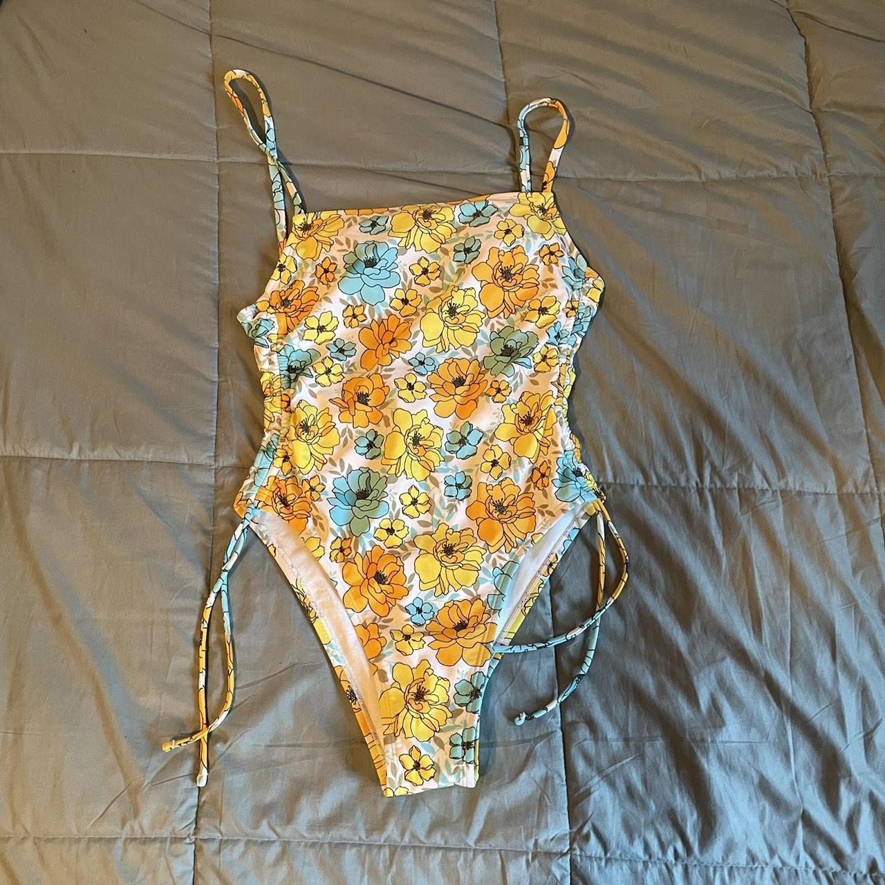 floral one piece swim suit with open back, never... - Depop