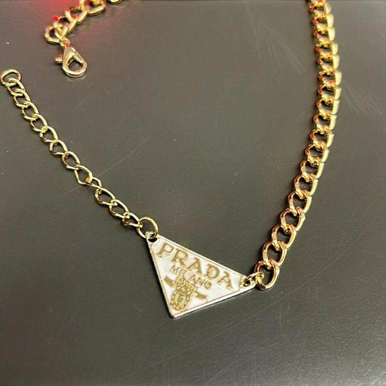 Prada 💅🏻💅🏻 white and gold Prada bracelet w monogram /... - Depop