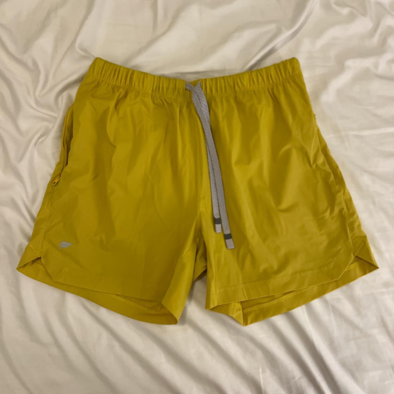 Fabletics yellow nylon running shorts (Worn a few... - Depop