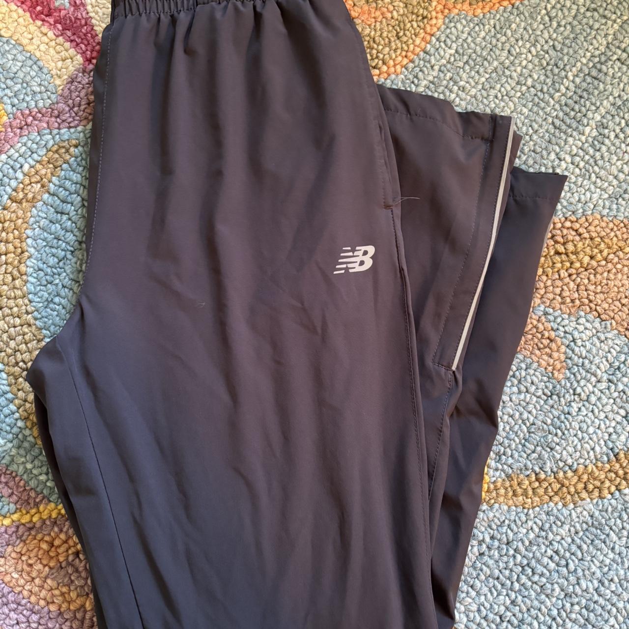 Dark grey New Balance track pants with zipper and... - Depop