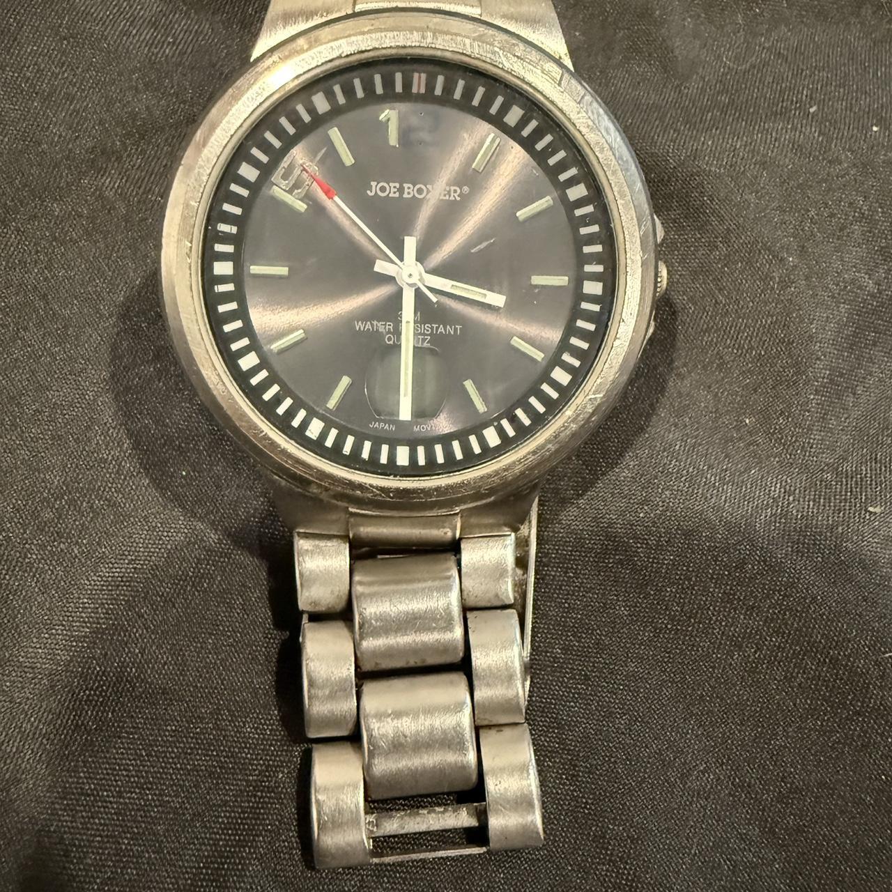 Silver analogue watch with water-resistant features... | Depop