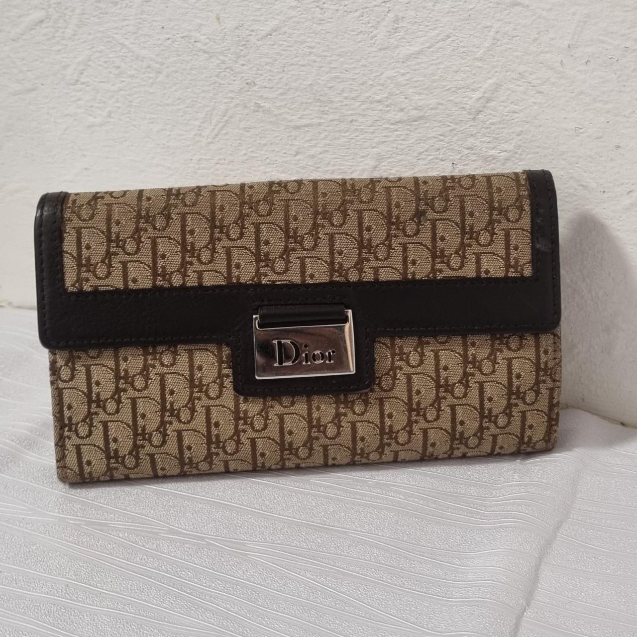 Dior monogram wallet. Features a tan monogram body,... - Depop