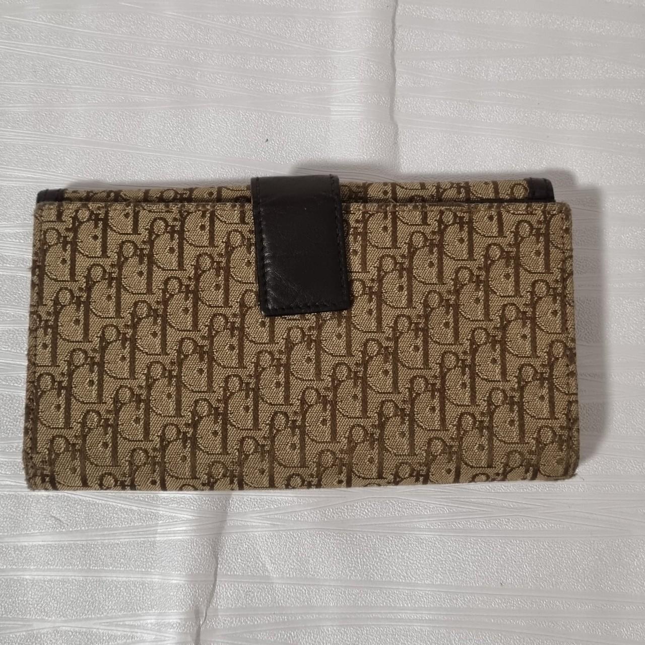 Dior monogram wallet. Features a tan monogram body,... - Depop