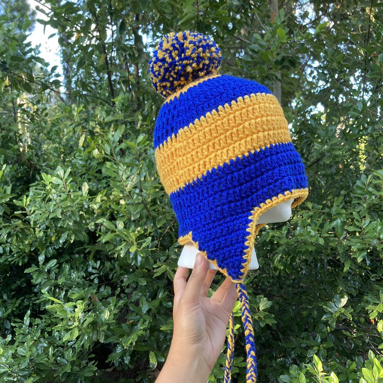 Blue and yellow striped trapper hat with pom pom... - Depop