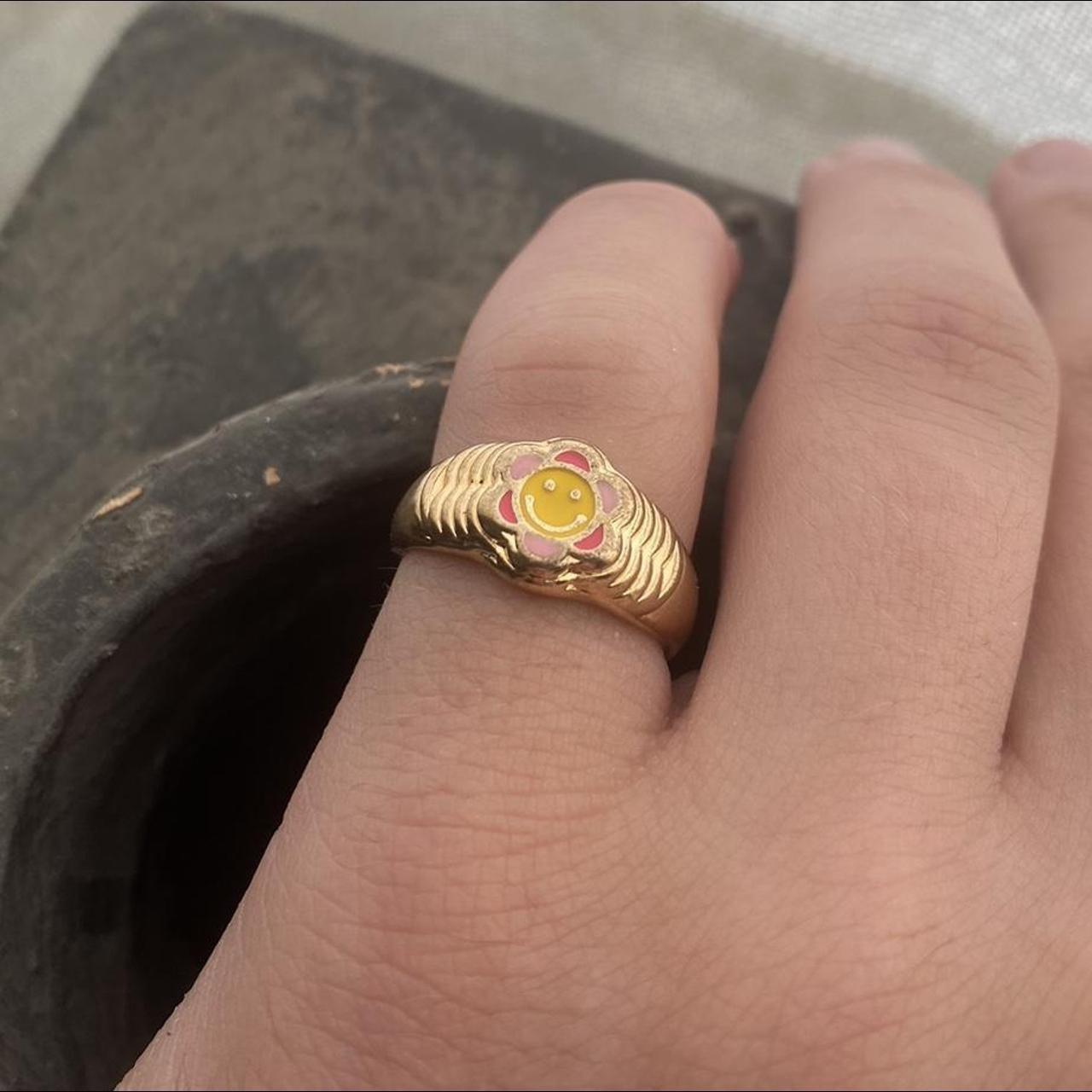 Women’s pink flower and yellow smiley face gold ring... - Depop