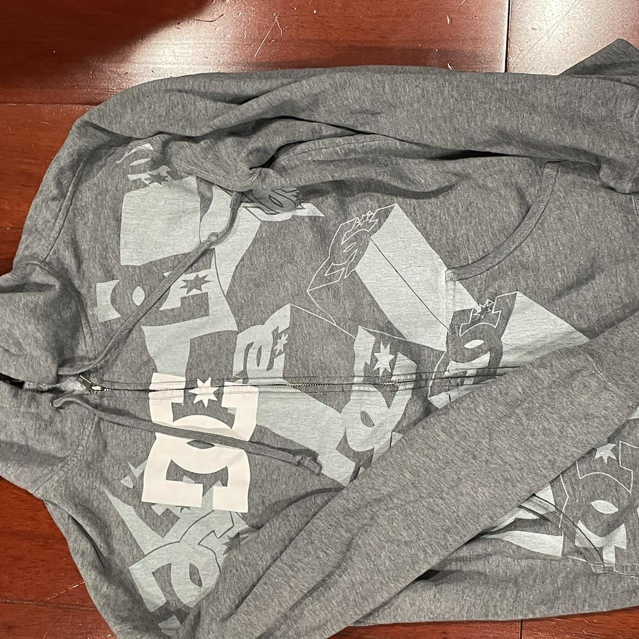 Grey DC Shoes zip-up hoodie with all-over print... - Depop