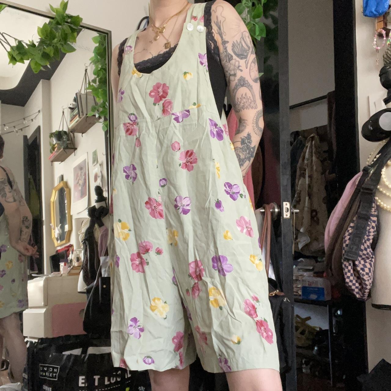 Express floral overall romper with the cutest button... - Depop