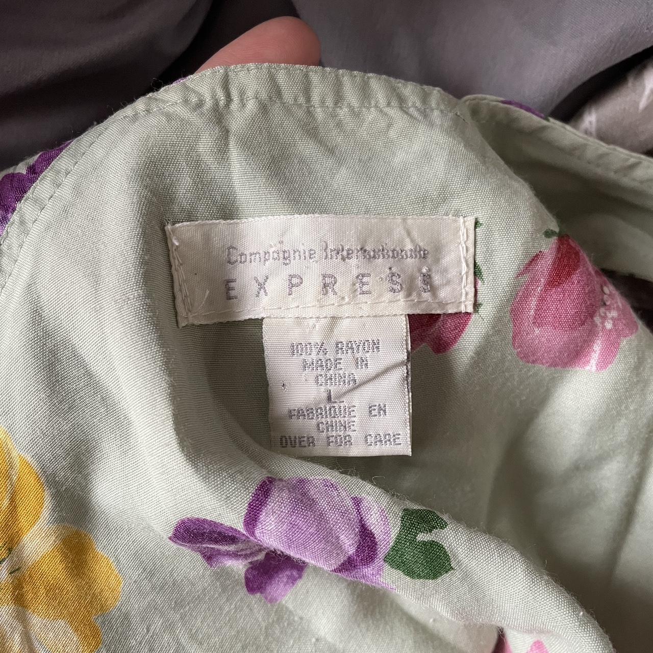 Express floral overall romper with the cutest button... - Depop