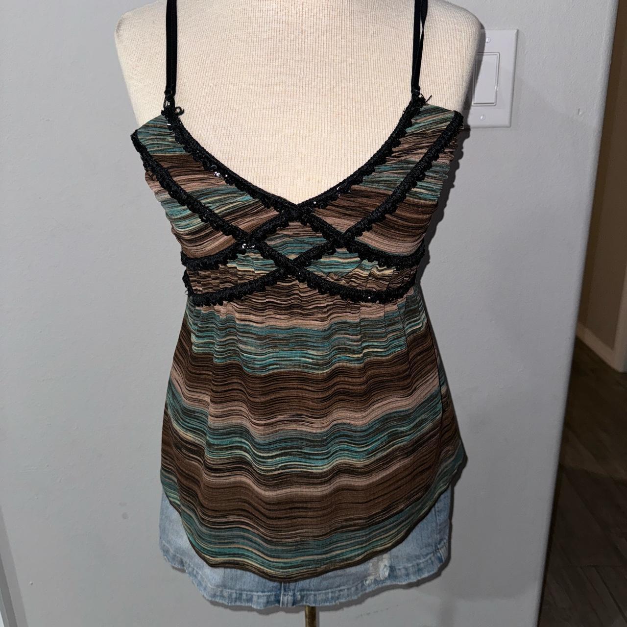 Spaghetti strap top flowy at the bottom only flaw is... - Depop