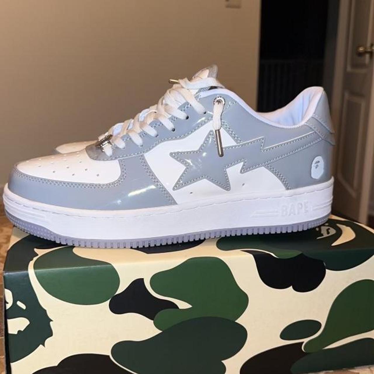size 11.5 and fits like 12 grey and white bapestas - Depop