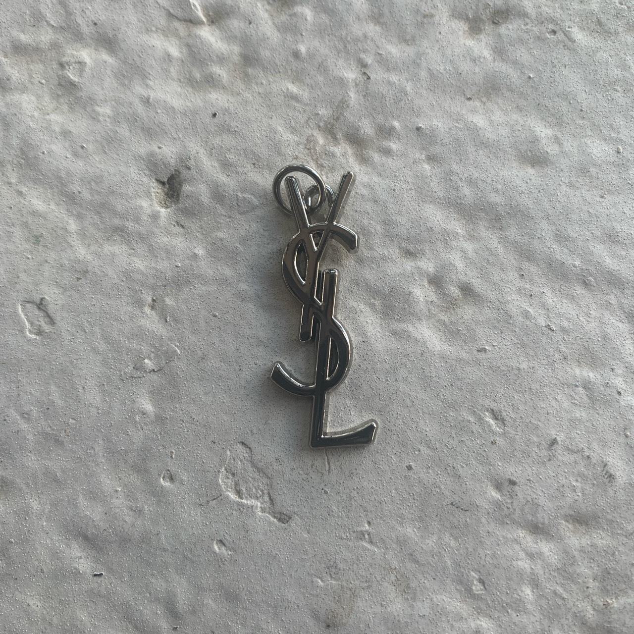 Ysl silver toned charm. - Depop