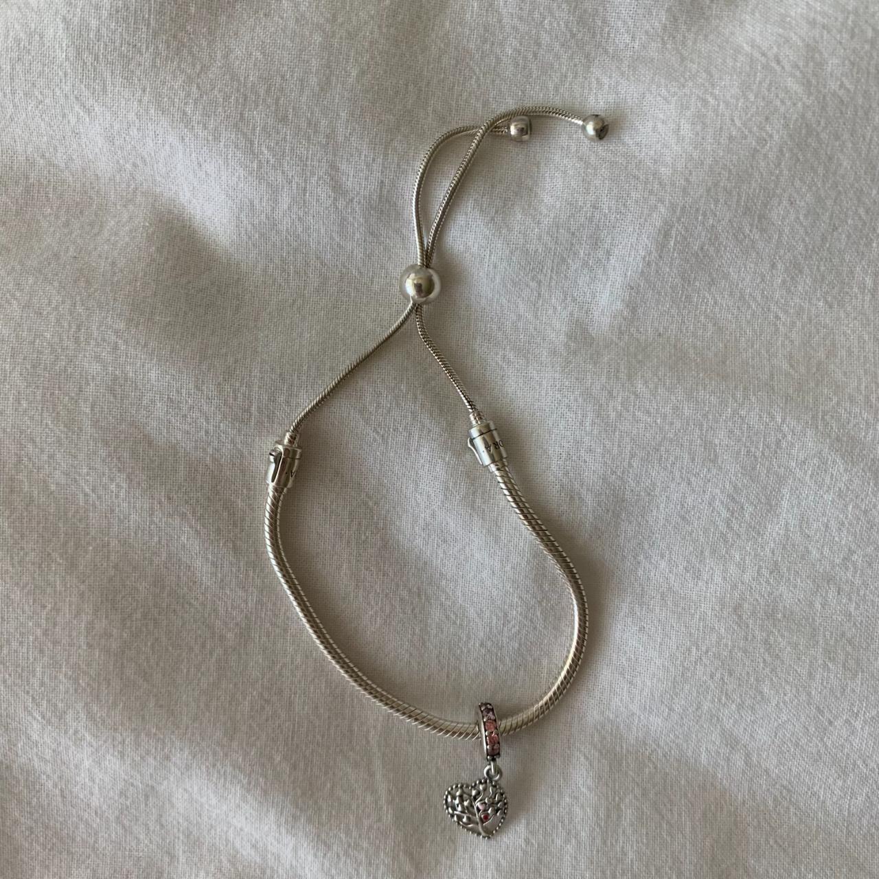 Silver Pandora drawstring bracelet with charm. Charm... - Depop