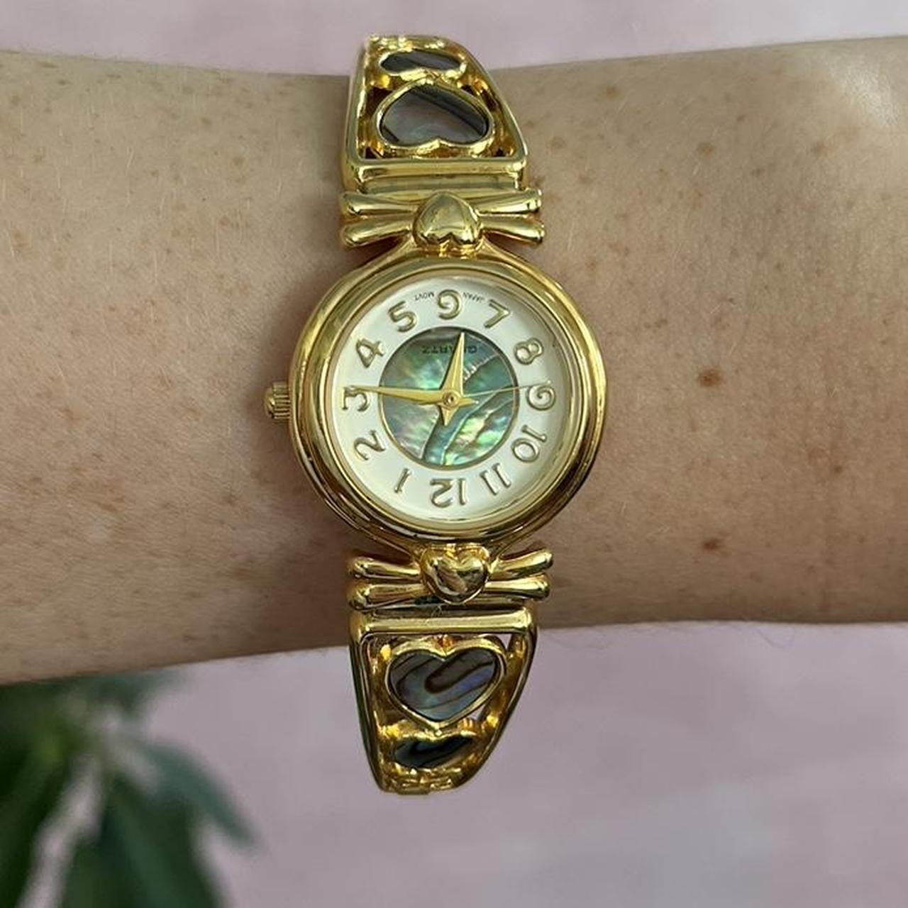 Avon gold tone quartz watch with abalone heart inlay... | Depop