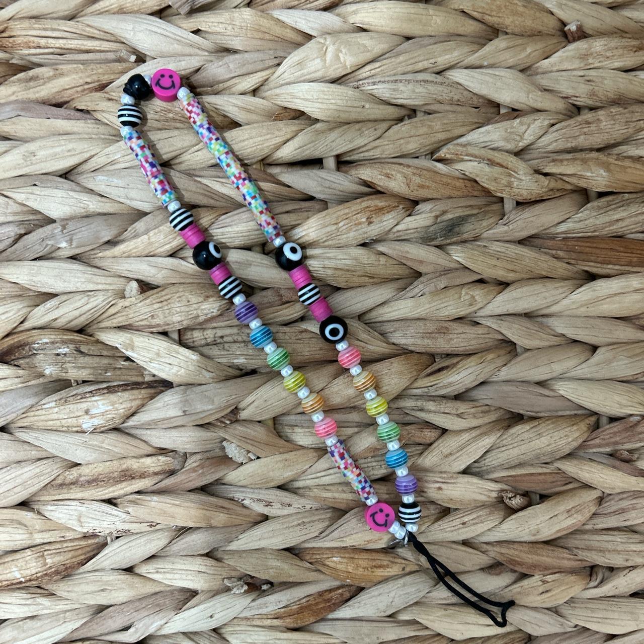 String Ting phone charm - Depop