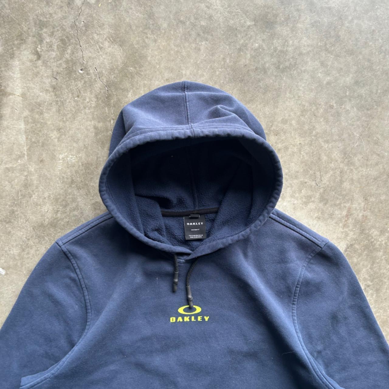 vintage early 2000s style OAKLEY hoodie centered... - Depop