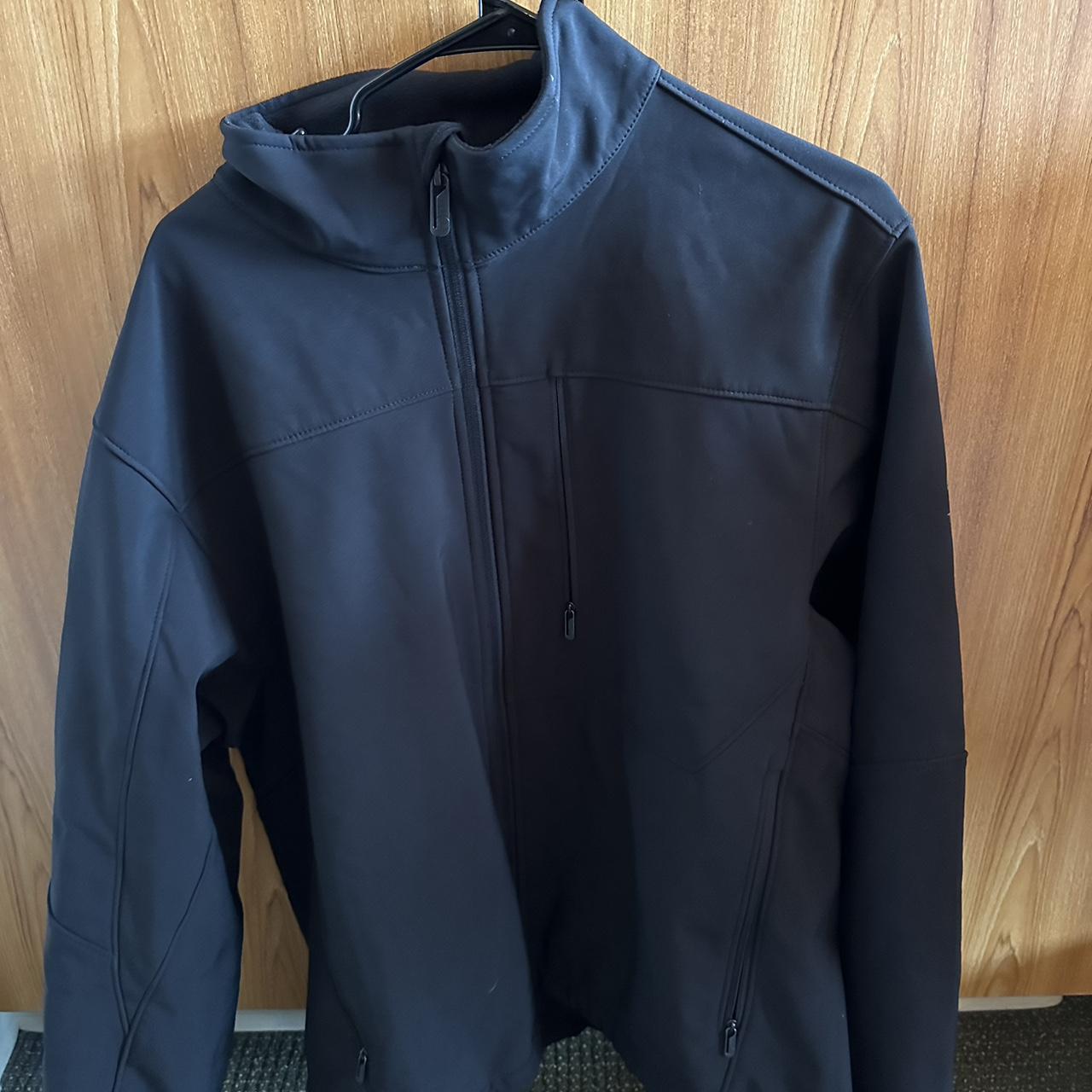 Large black Tumi Jacket. 3 pockets total, with two... - Depop