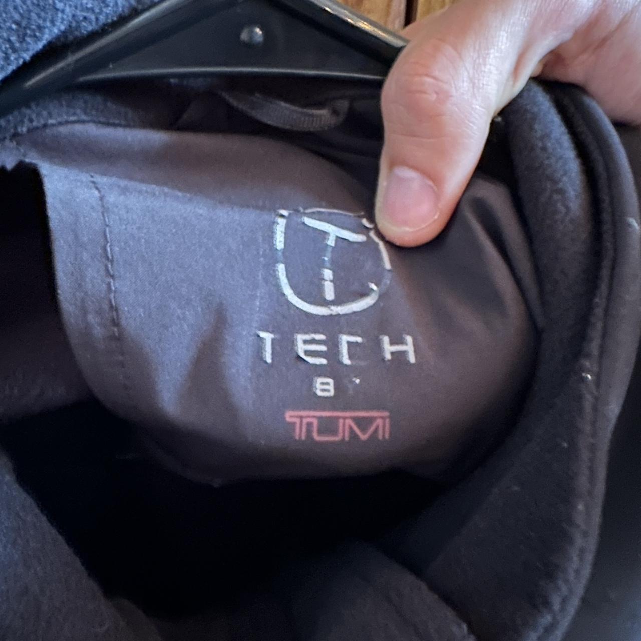 Large black Tumi Jacket. 3 pockets total, with two... - Depop