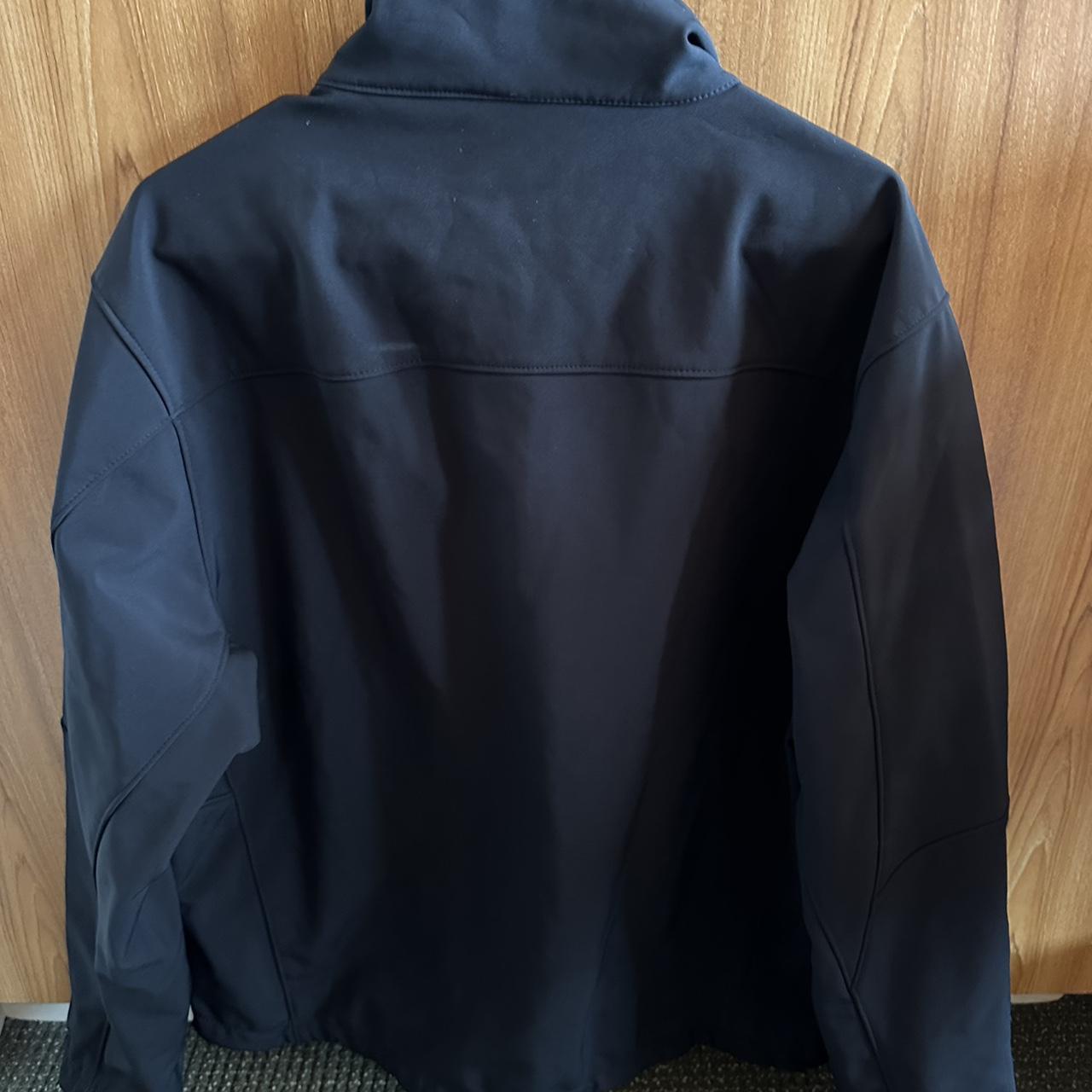 Large black Tumi Jacket. 3 pockets total, with two... - Depop