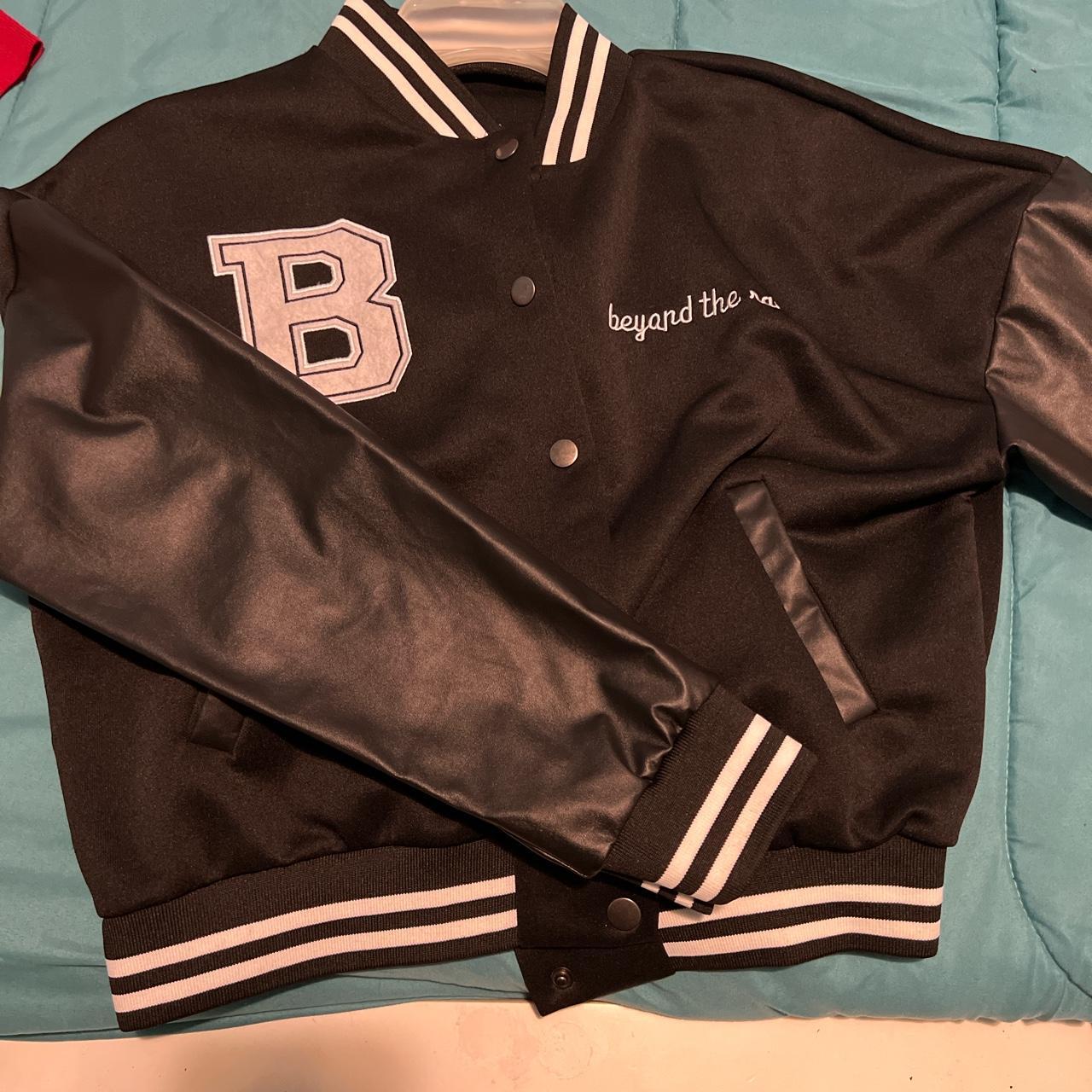 Black and white varsity button up jacket. Between a... - Depop