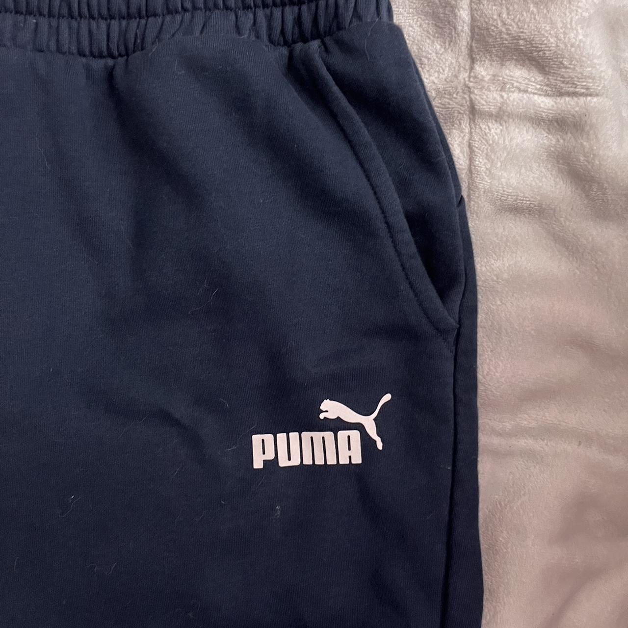 Puma dark blue sweatpants size L with white puma logo - Depop