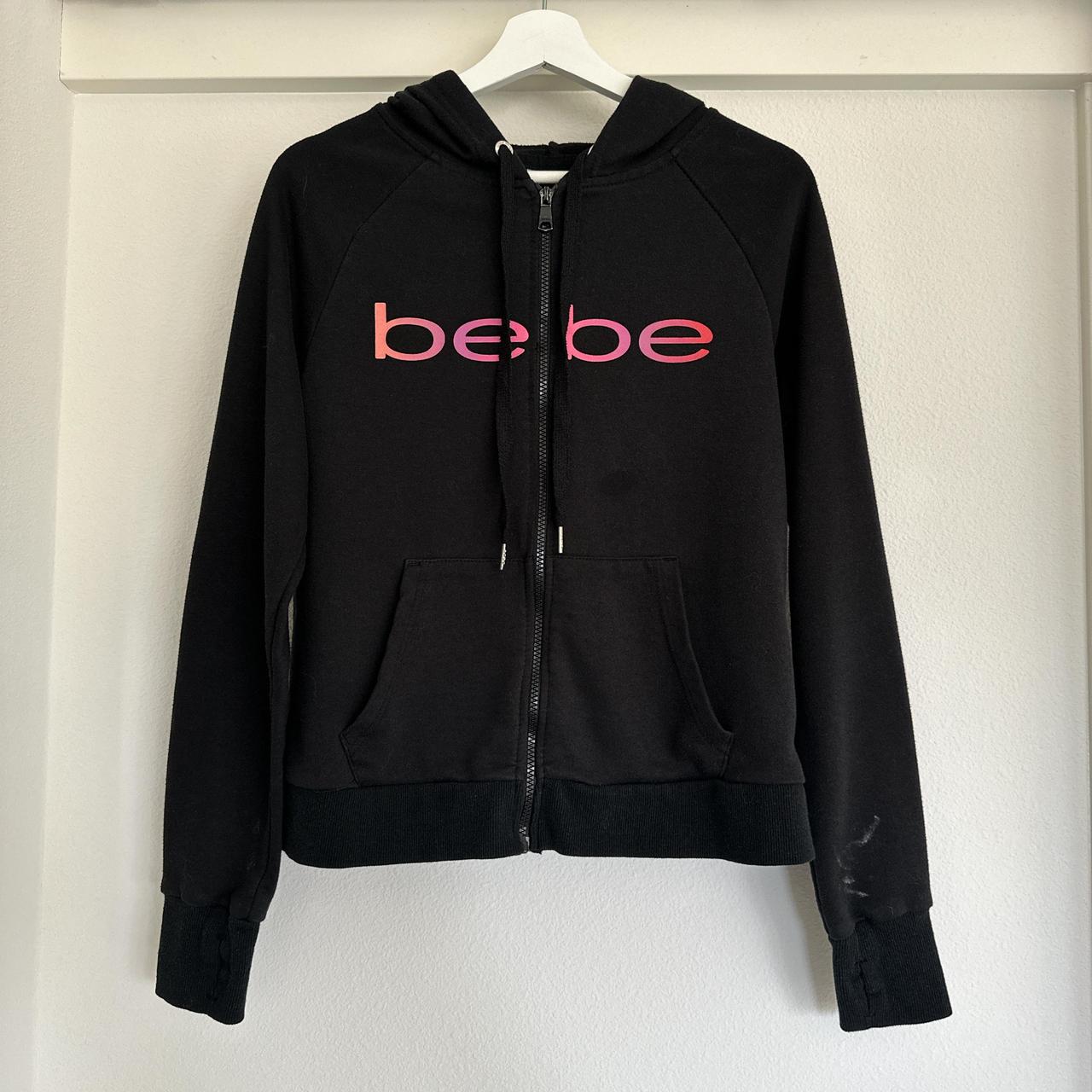 Bebe black and pink zip up hoodie. Faint oil stain... - Depop