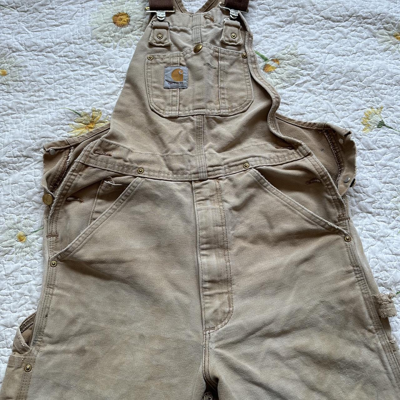 30/32 well broken in carhartt overalls. Hole in... - Depop