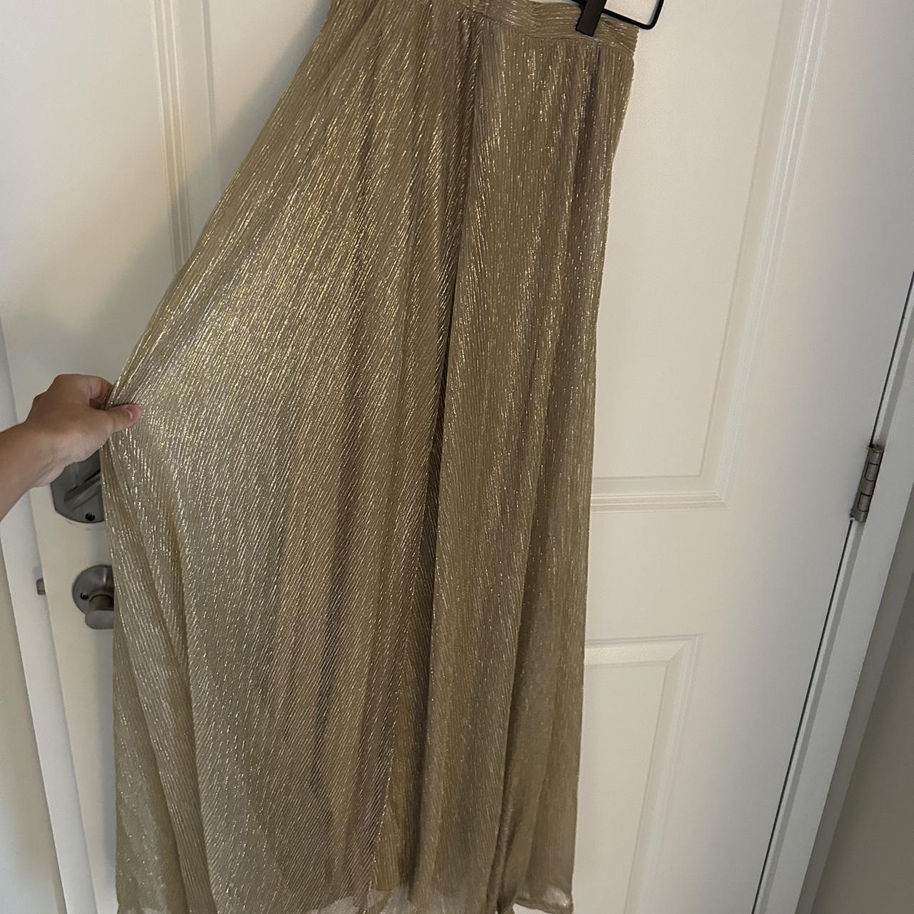 Shiny gold skirt. It’s floor length and super pretty... - Depop