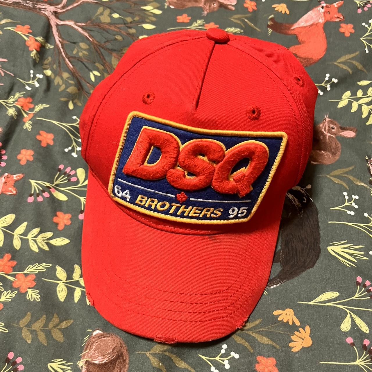 DSQ red cap Worn a few times with a small black mark... - Depop