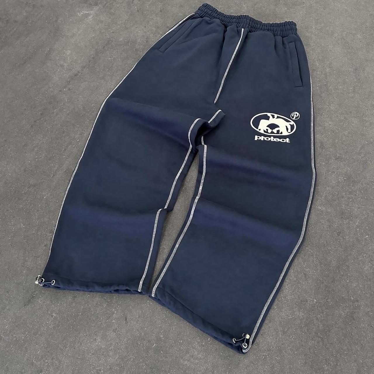 Protect London Navy Joggers Brand new Sold out... - Depop