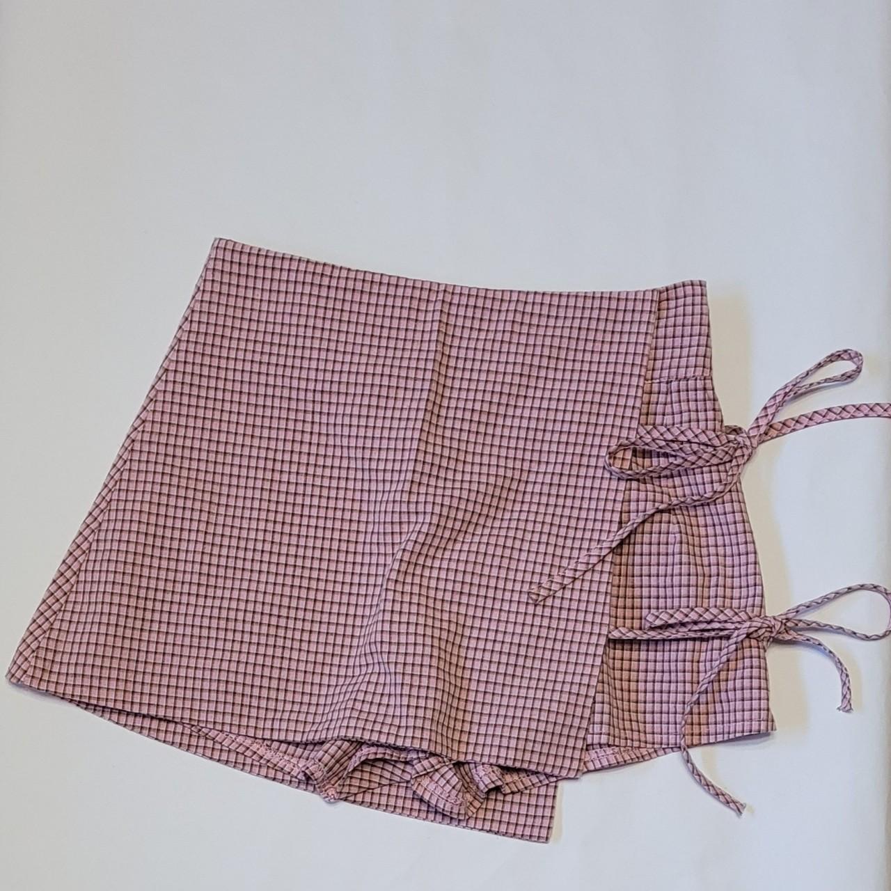 Cute pink skort with light brown squared pattern.... - Depop
