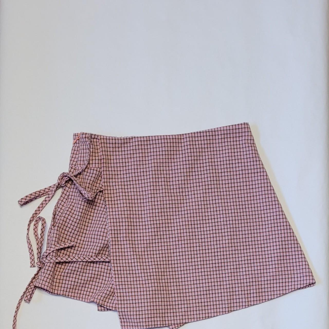 Cute pink skort with light brown squared pattern.... - Depop